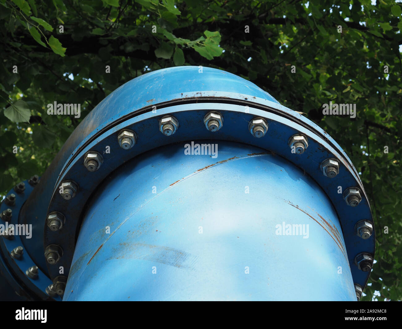 big blue steel water pipes with bolts Stock Photo - Alamy