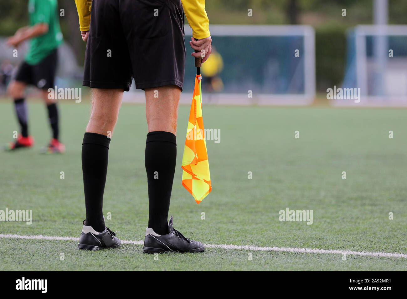 The line referee observes the situation on the football field Stock ...