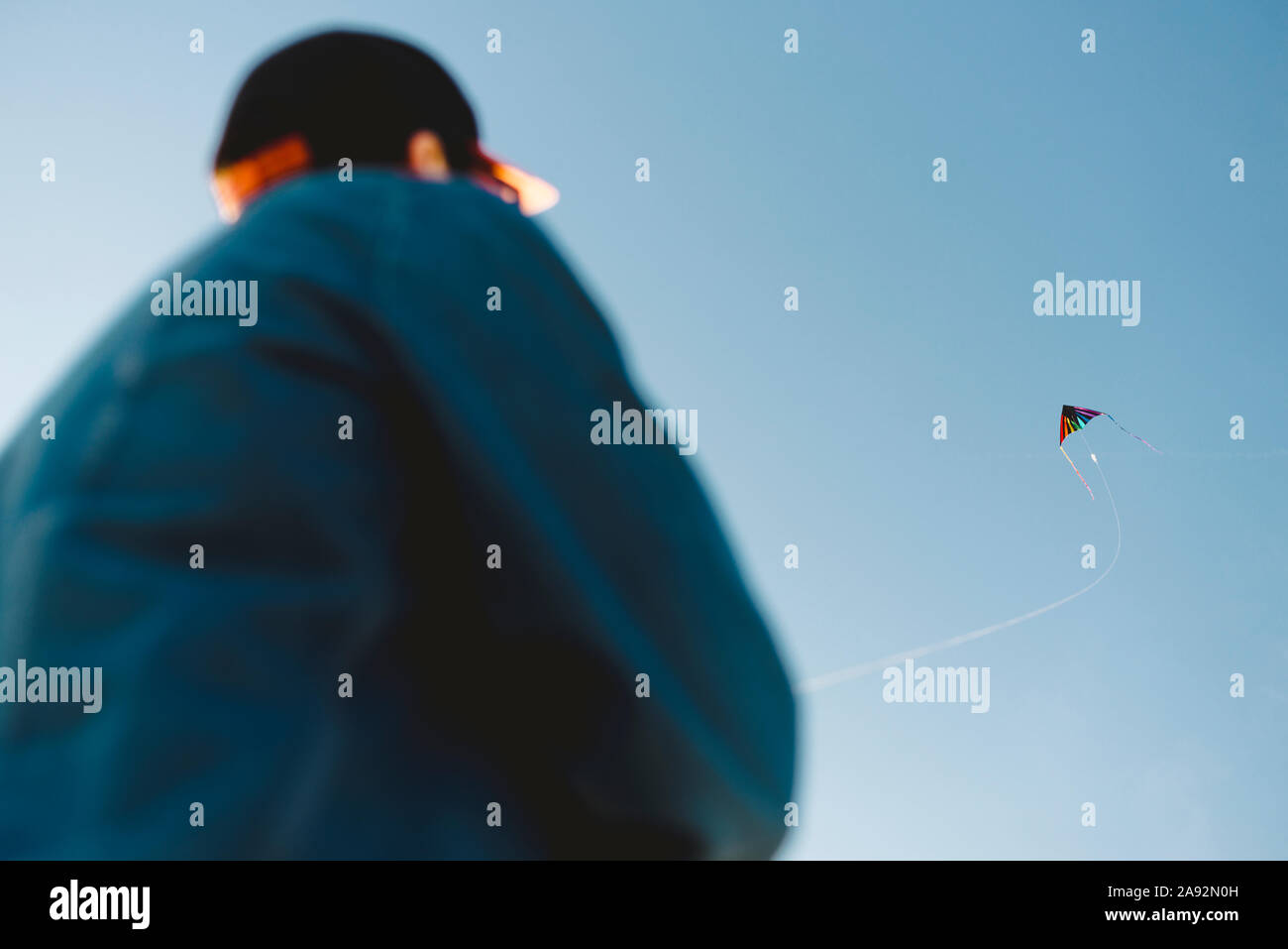 Man flying kite Stock Photo - Alamy