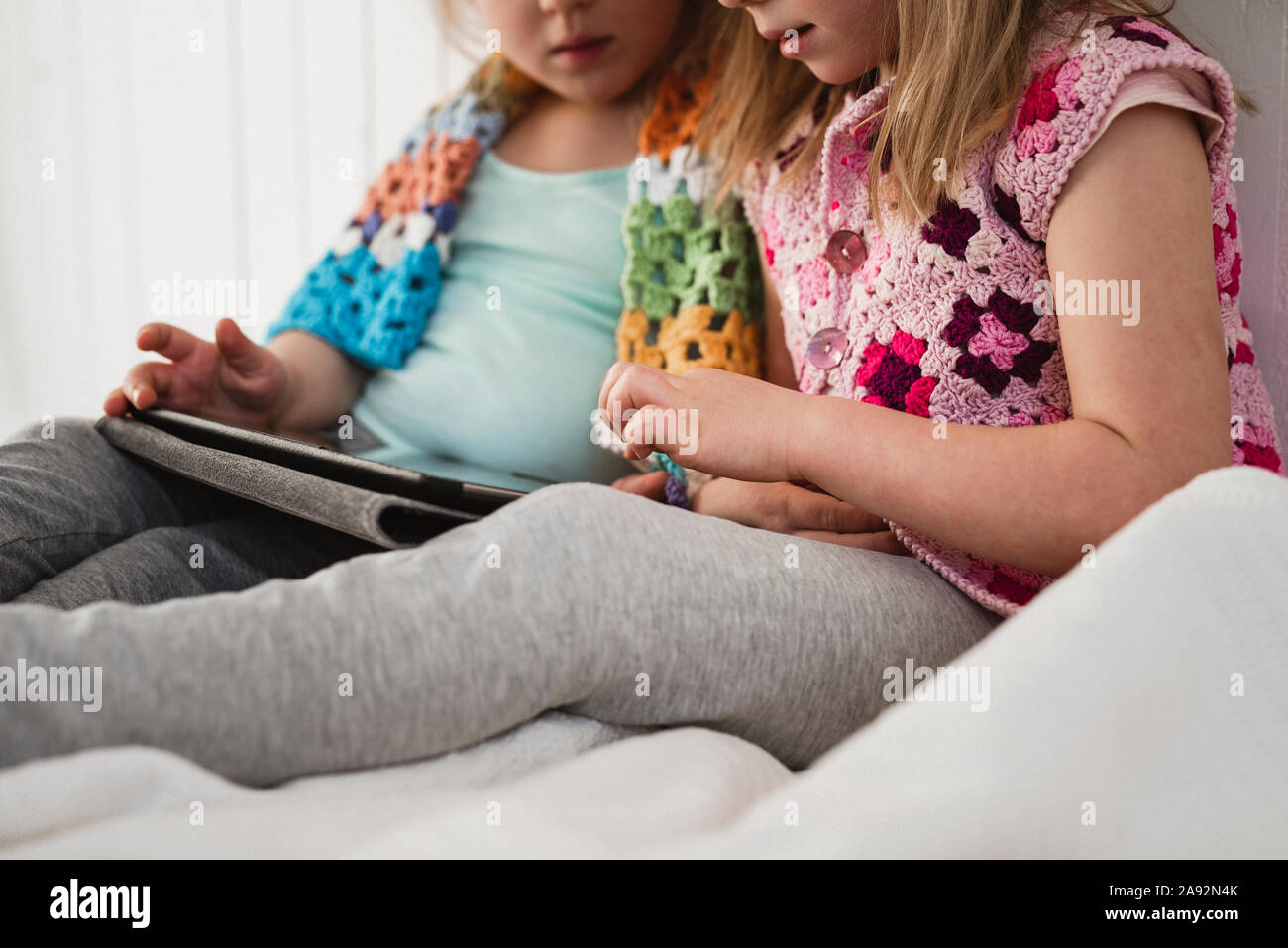 Girls using digital tablet Stock Photo - Alamy