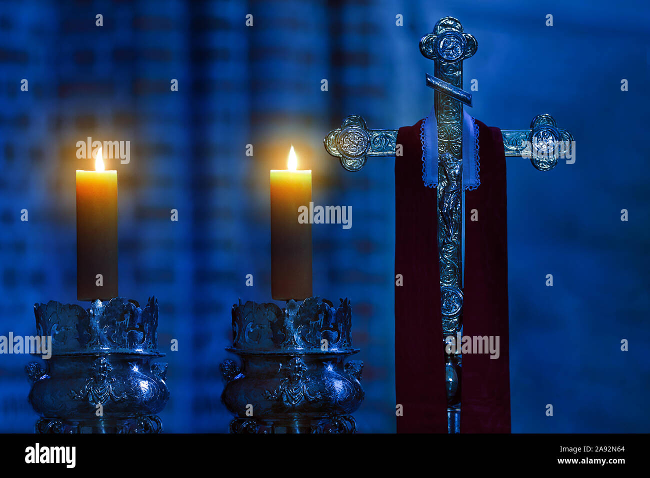 Holy bishop's cross with stole and candles in the dark cathedral Stock ...