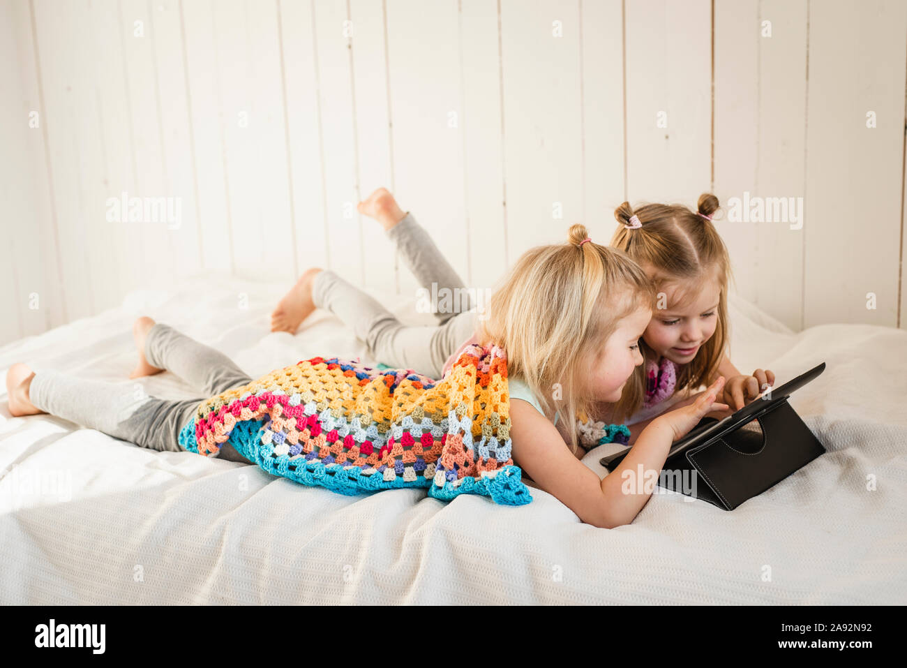 Girls using digital tablet Stock Photo - Alamy