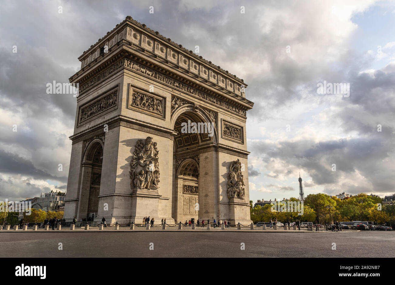 Arc de Triomphe in Paris. In distance there is visible Eiffel Tower Stock Photo - Alamy