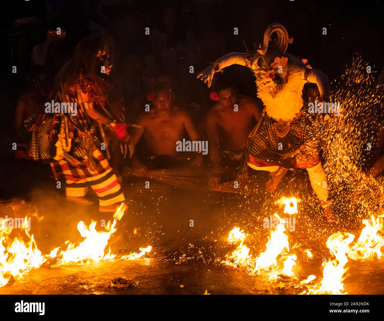 Fire dance during a Kecak dance performance; Uluwatu, Bali, Indonesia ...