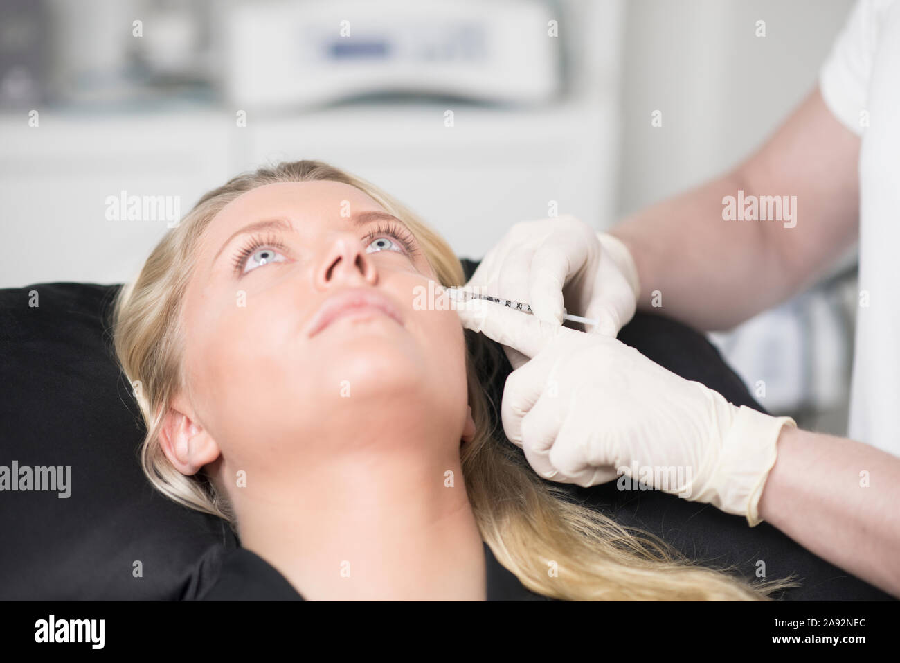 Woman receiving Botox injection Stock Photo - Alamy