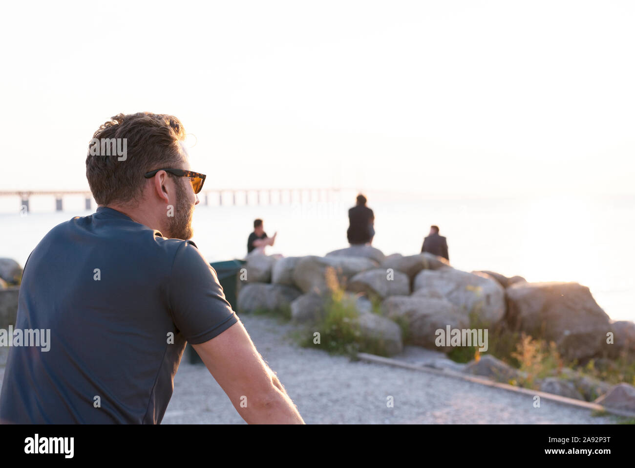 Man looking at sea Stock Photo - Alamy