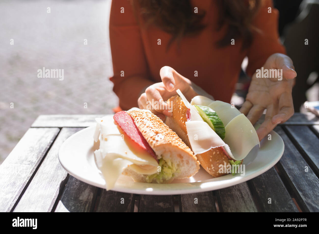 Woman having sandwich Stock Photo - Alamy