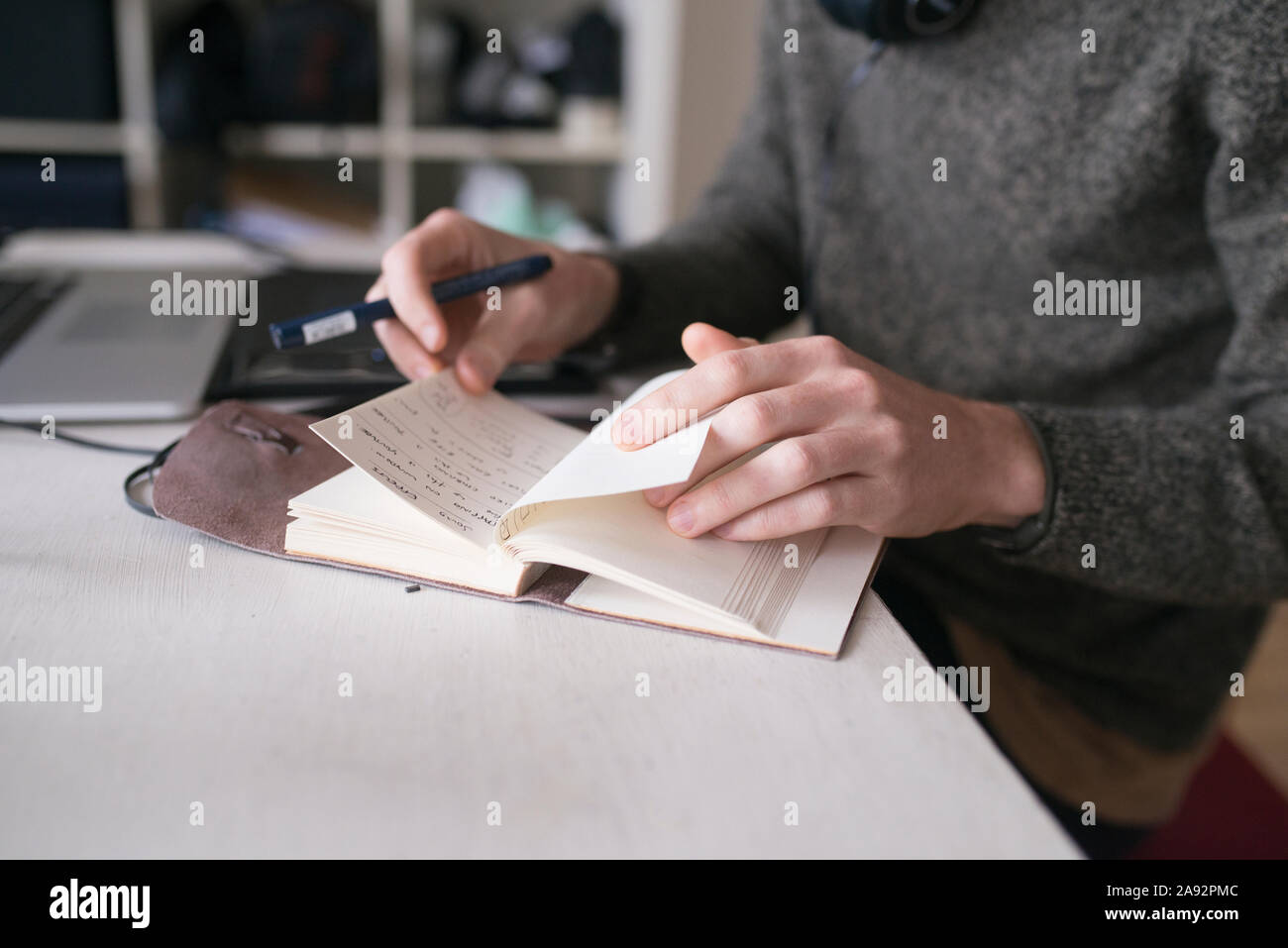 Man writing notes in diary Stock Photo - Alamy