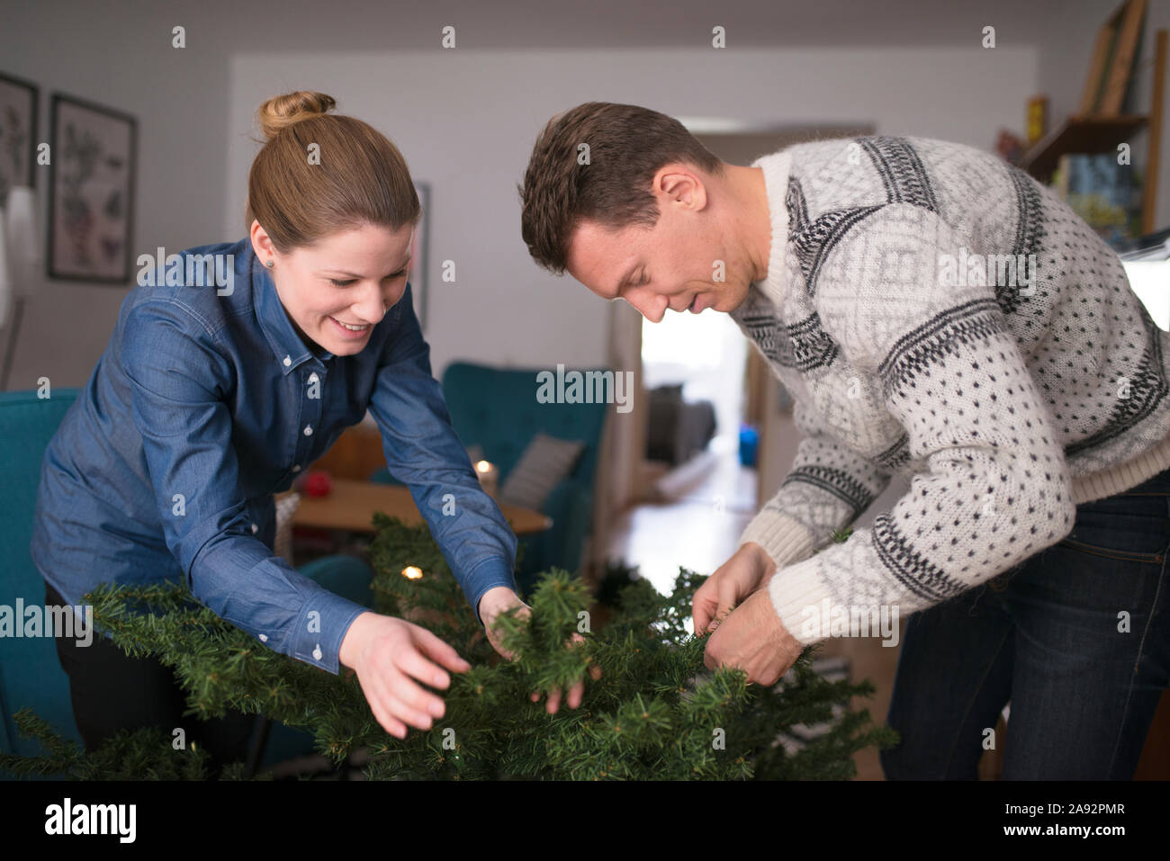 Couple together christmas tree hi-res stock photography and images - Alamy