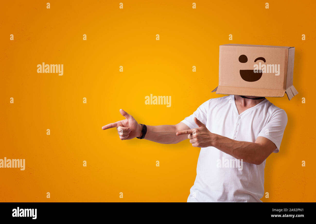 Funny man wearing cardboard box on his head with smiley face Stock ...