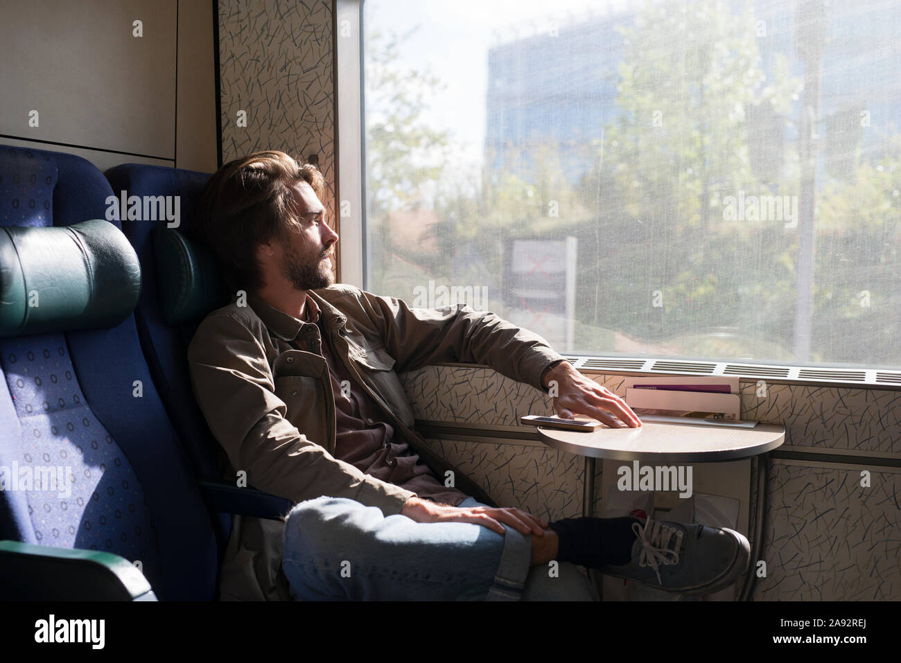 Man in train Stock Photo - Alamy