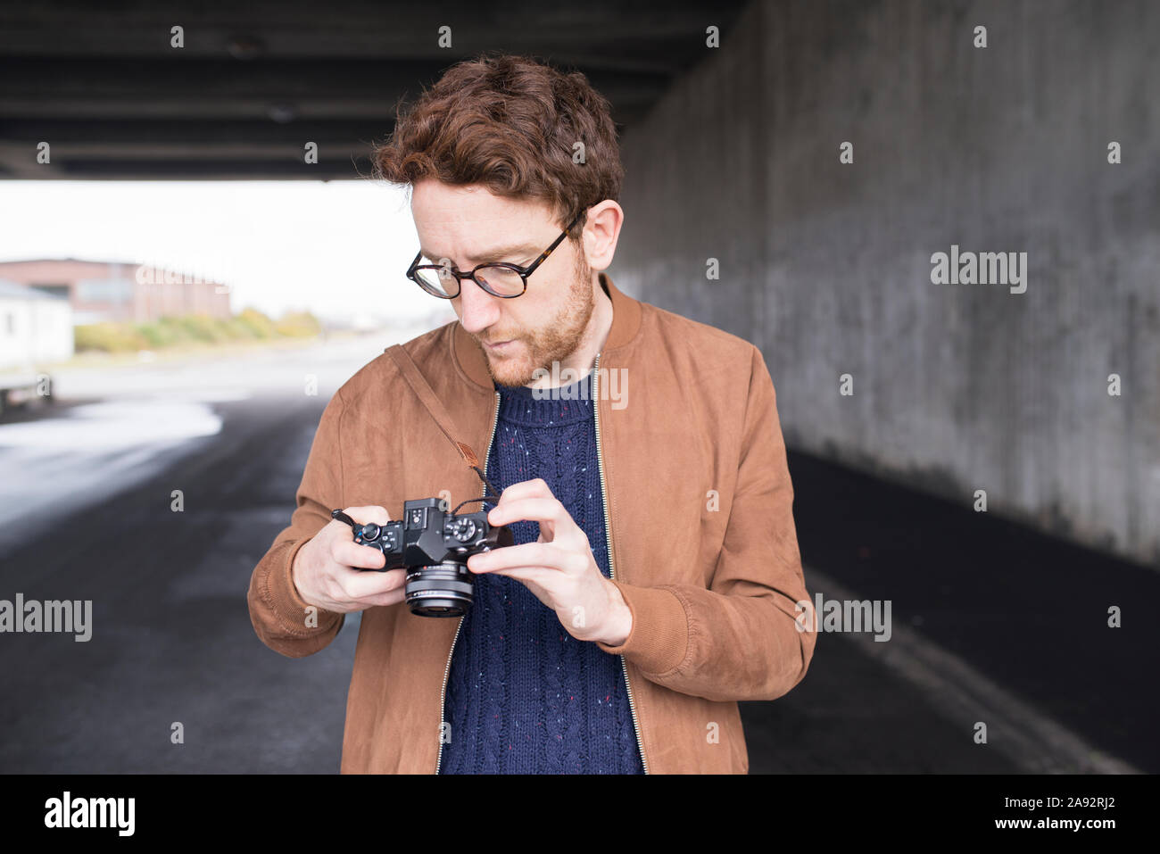Man checking camera Stock Photo - Alamy