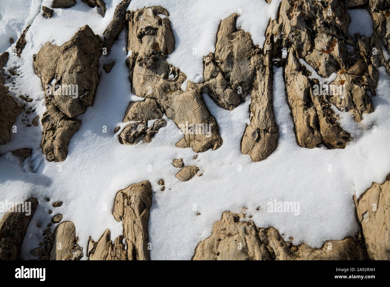 Snow covered rocks Stock Photo - Alamy