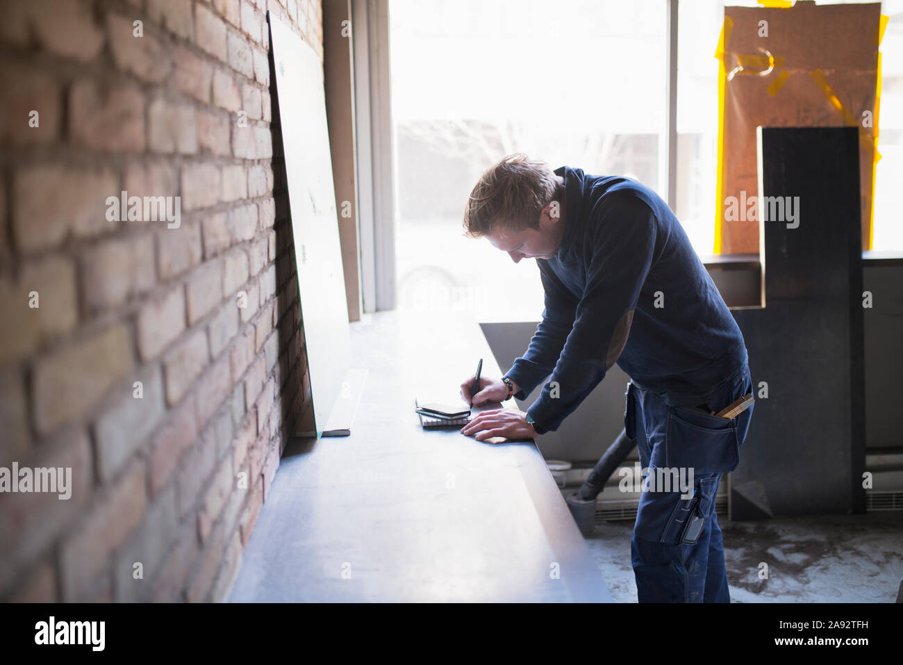 Man on building site Stock Photo - Alamy