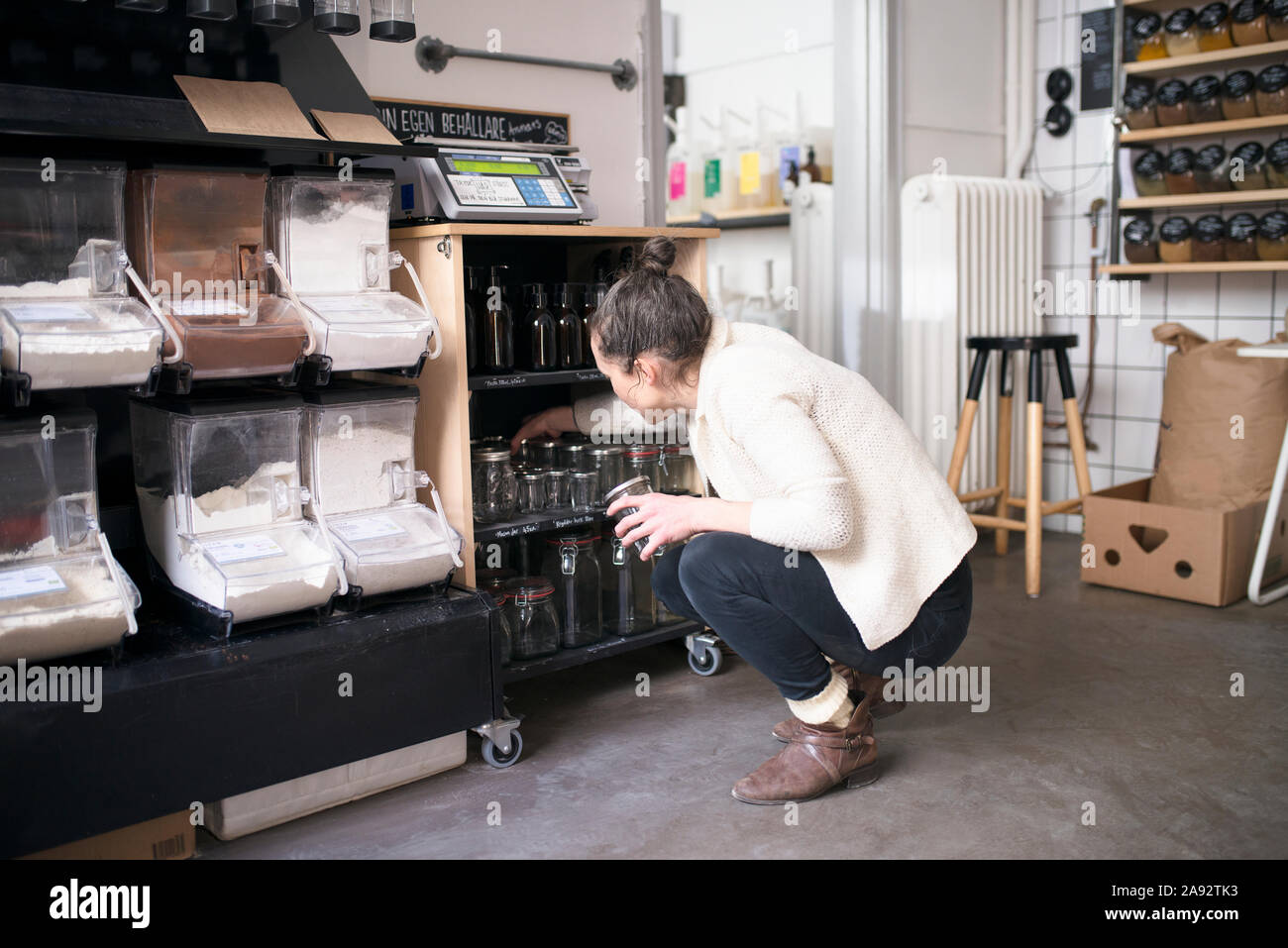 Working in shop hi-res stock photography and images - Alamy