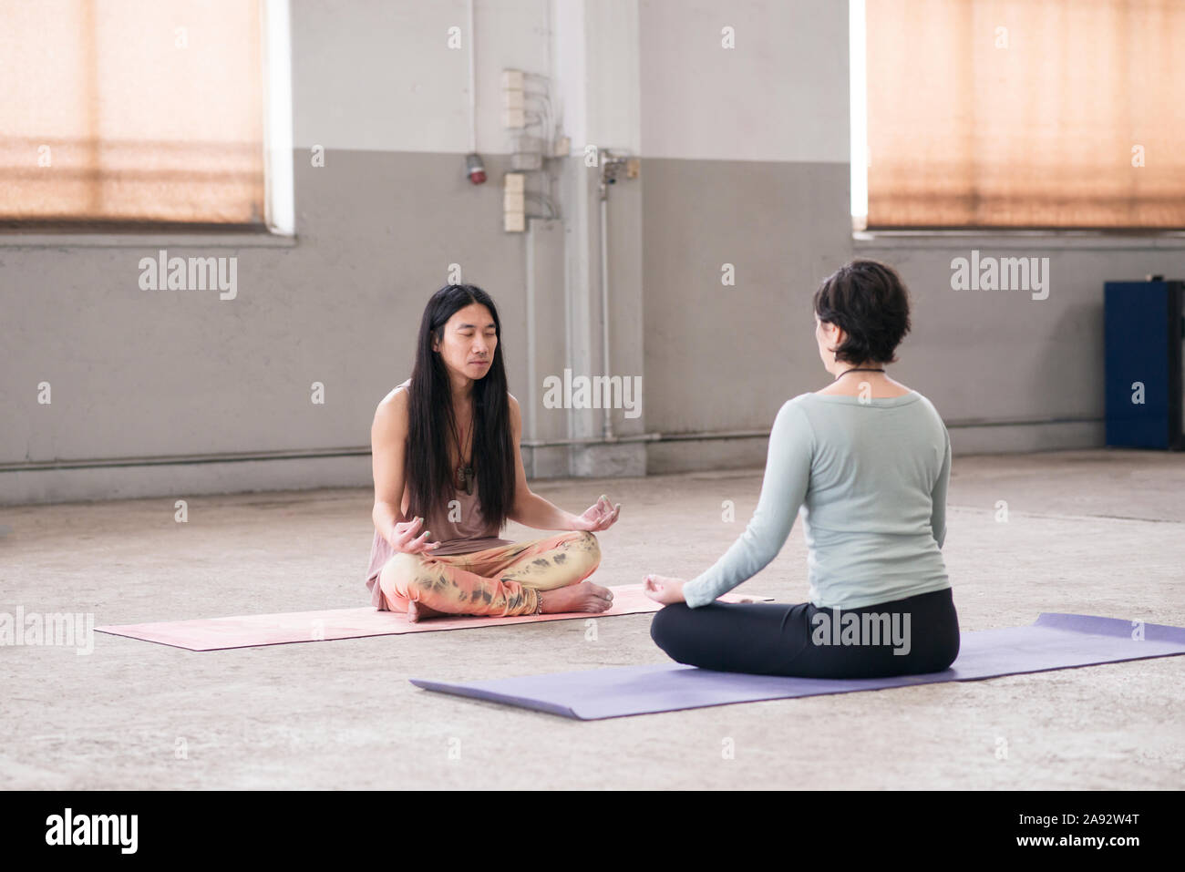 Couple meditating hi-res stock photography and images - Alamy