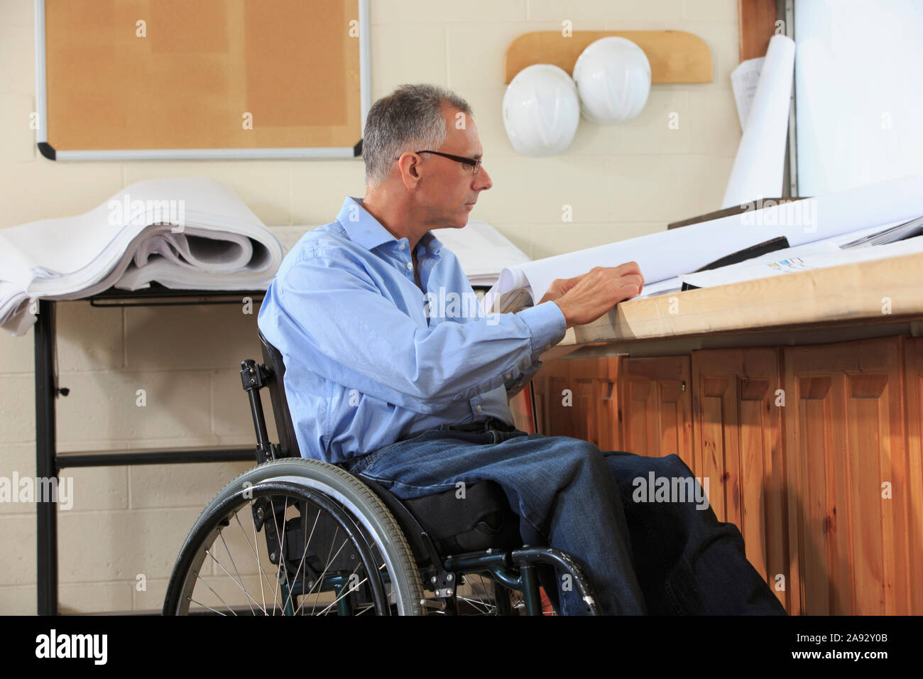 Project engineer with a Spinal Cord Injury in a wheelchair looking at ...