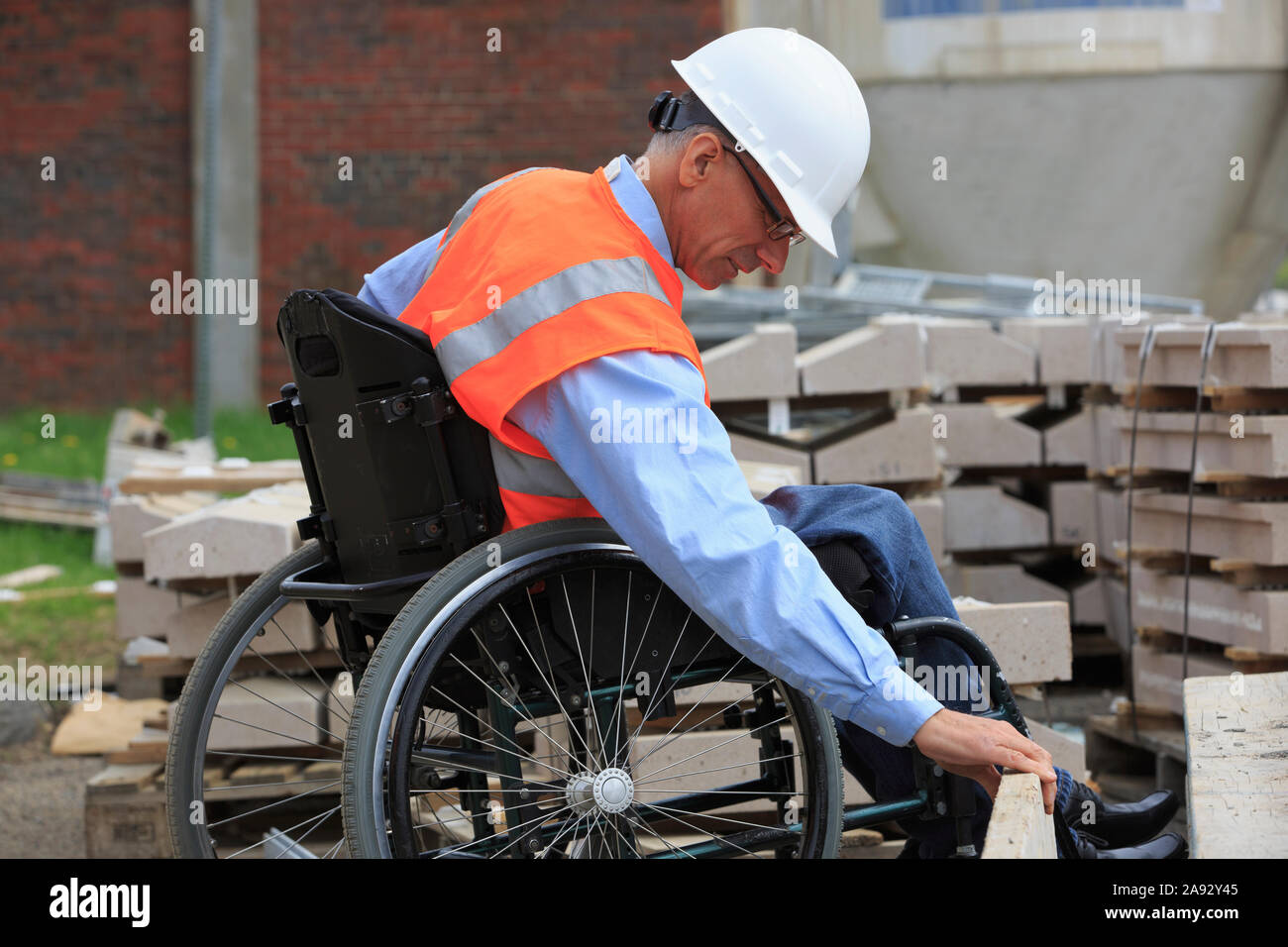 Project engineer with a Spinal Cord Injury in a wheelchair checking the ...