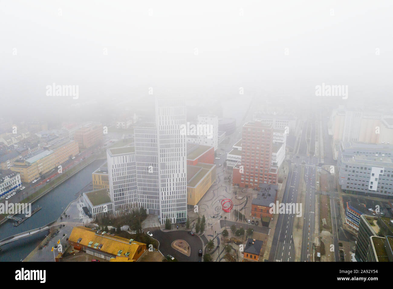 Cityscape in fog Stock Photo - Alamy
