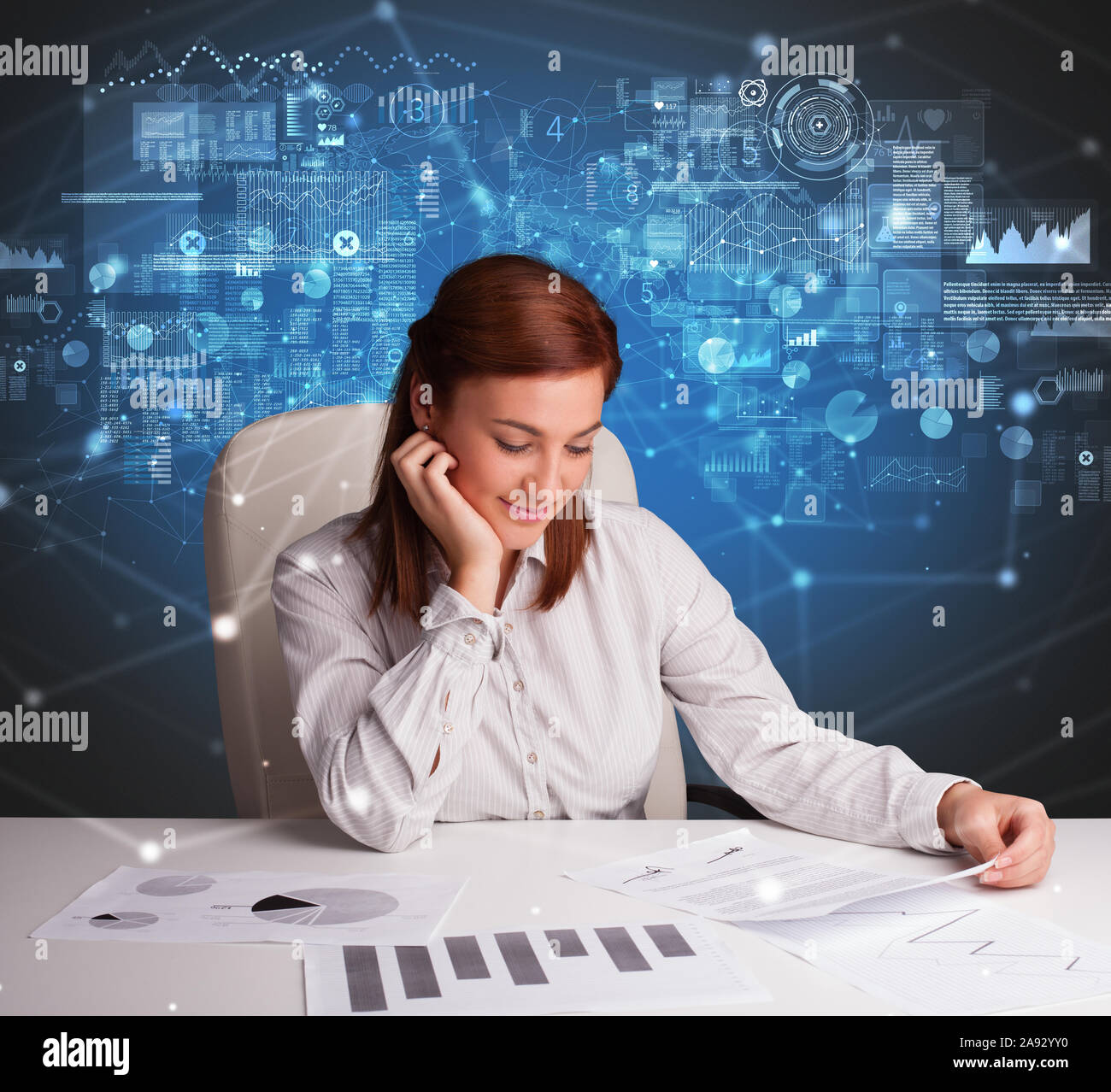 Young manager at the office making report and statistics Stock Photo ...