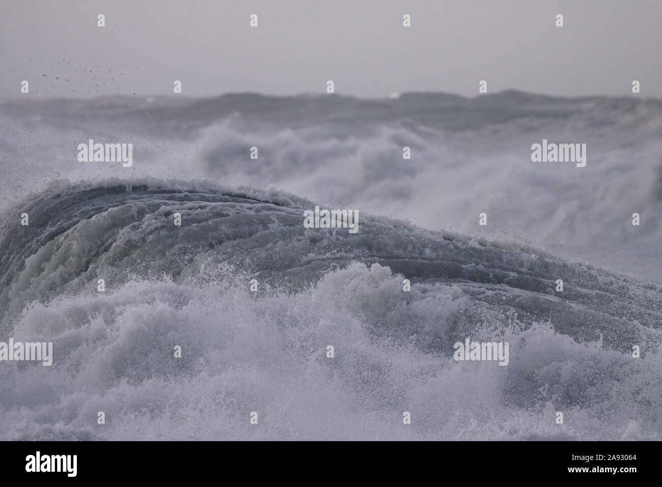 Detailed top of a big stormy breaking wave Stock Photo - Alamy