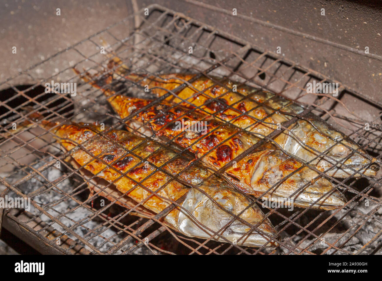 Grilled smoked Golden mackerel fish outside late at night Stock Photo ...
