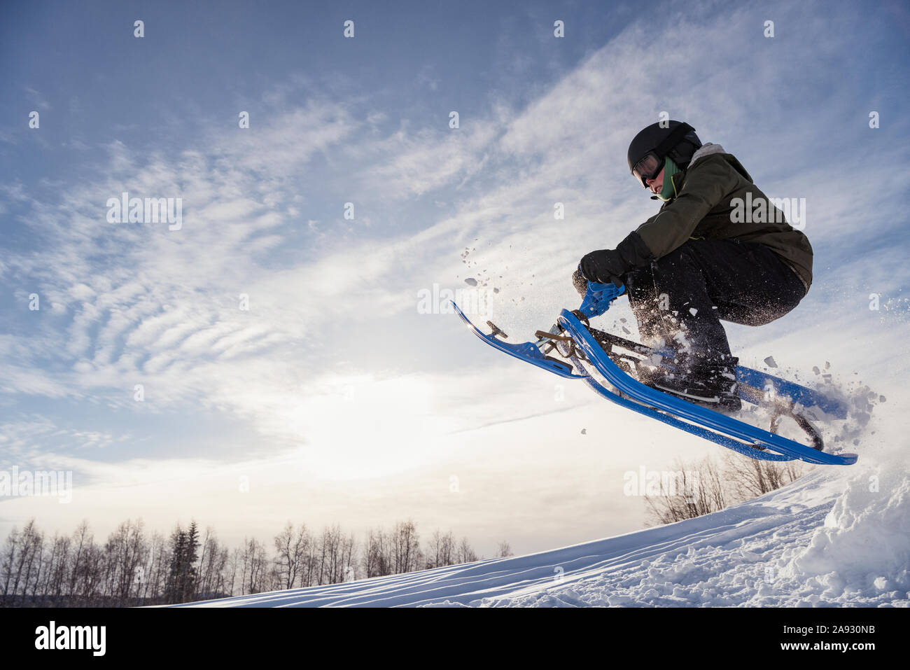 Boy on ski sledge Stock Photo - Alamy