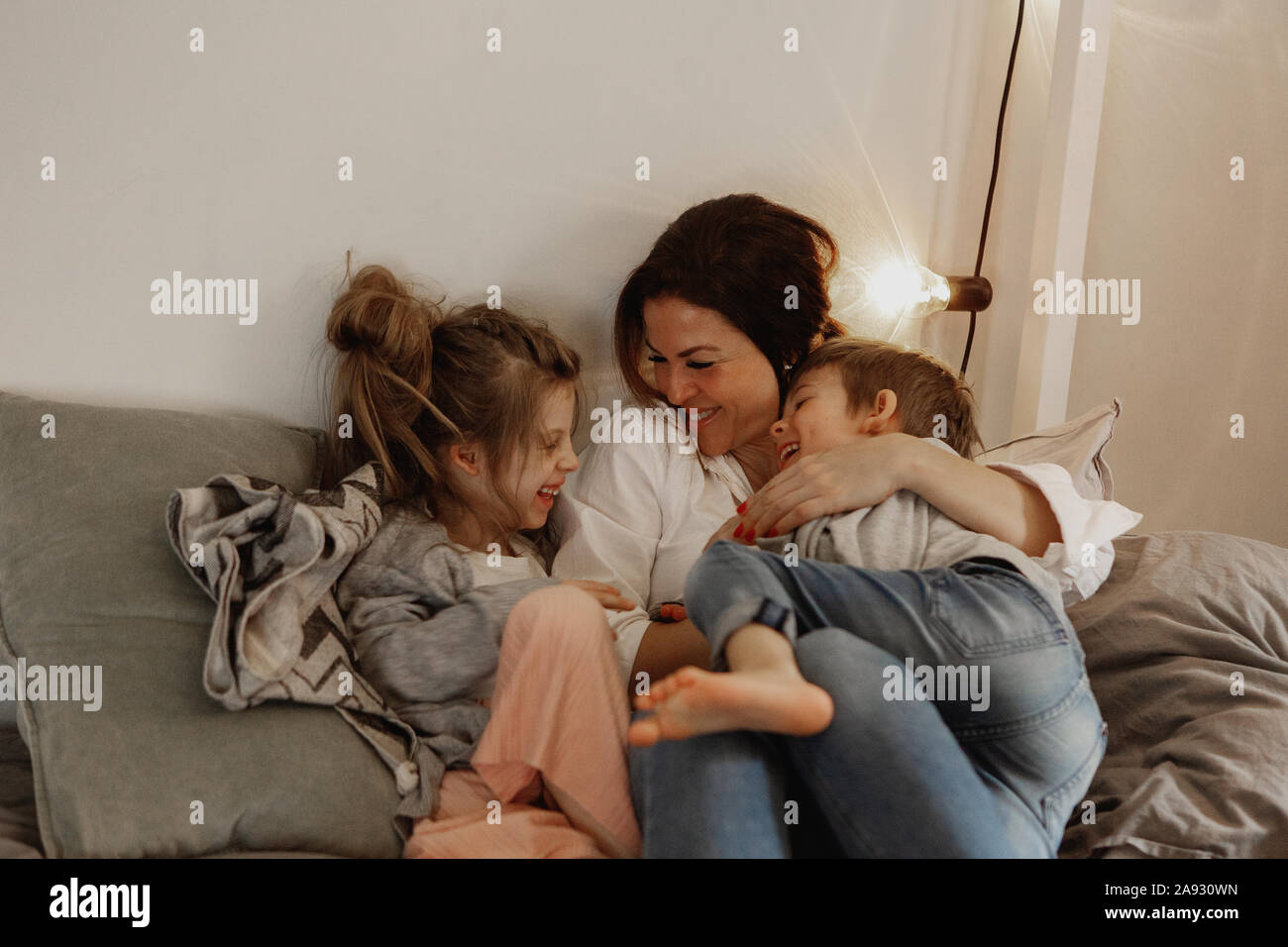 Mother reading to children Stock Photo - Alamy