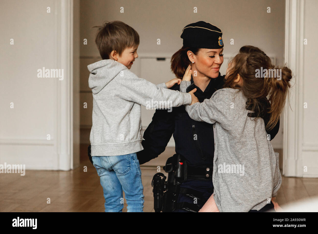 Police woman with children Stock Photo - Alamy