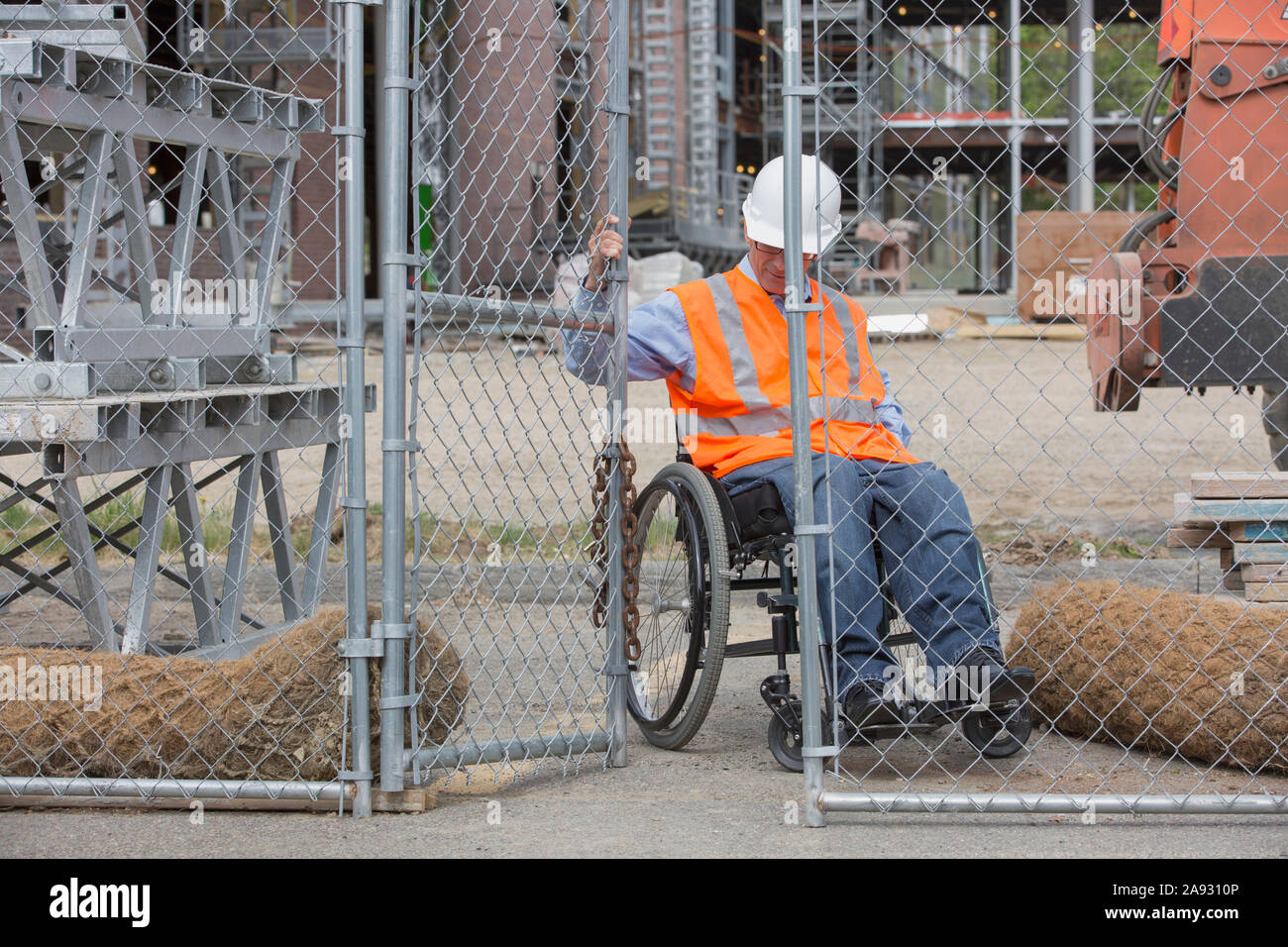 Project engineer with a Spinal Cord Injury in a wheelchair closing ...