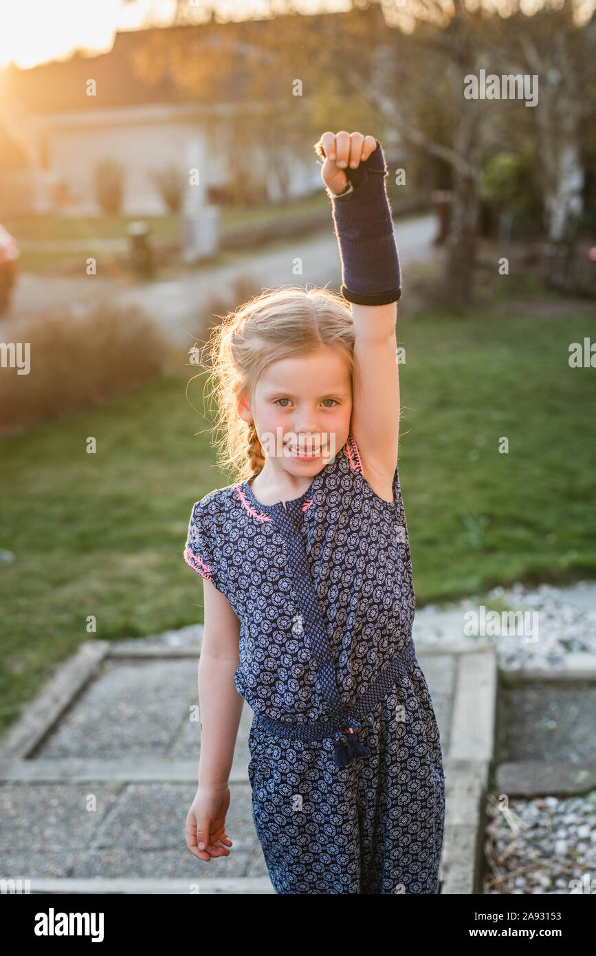 Girl with plastered arm Stock Photo - Alamy