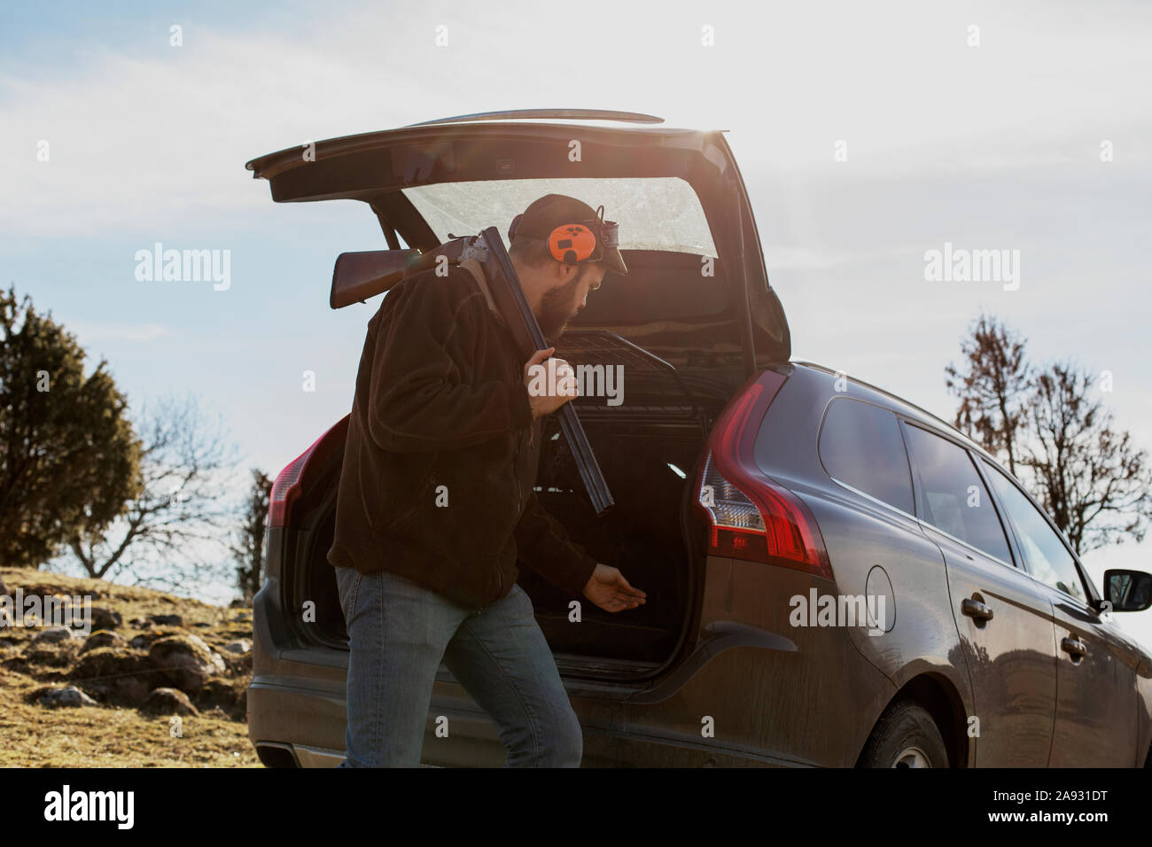 Man standing near car Stock Photo - Alamy