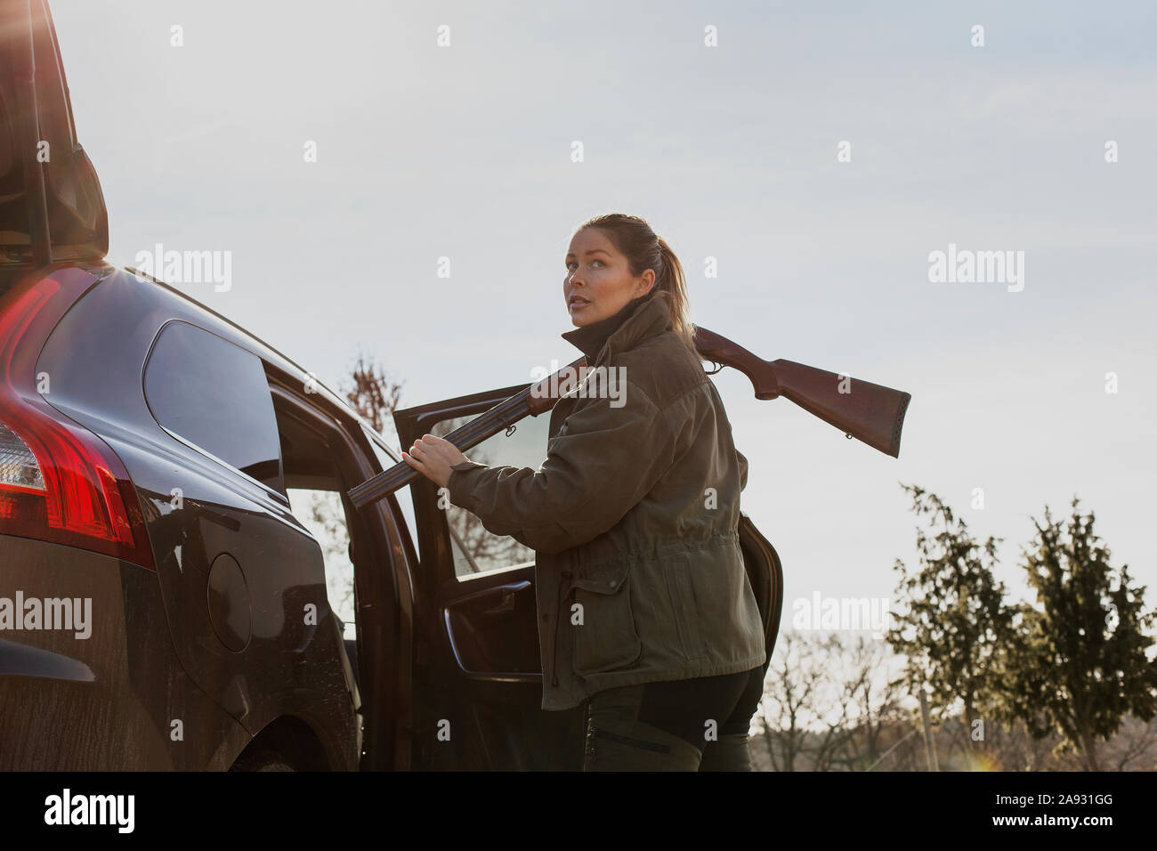 Woman standing near car Stock Photo - Alamy