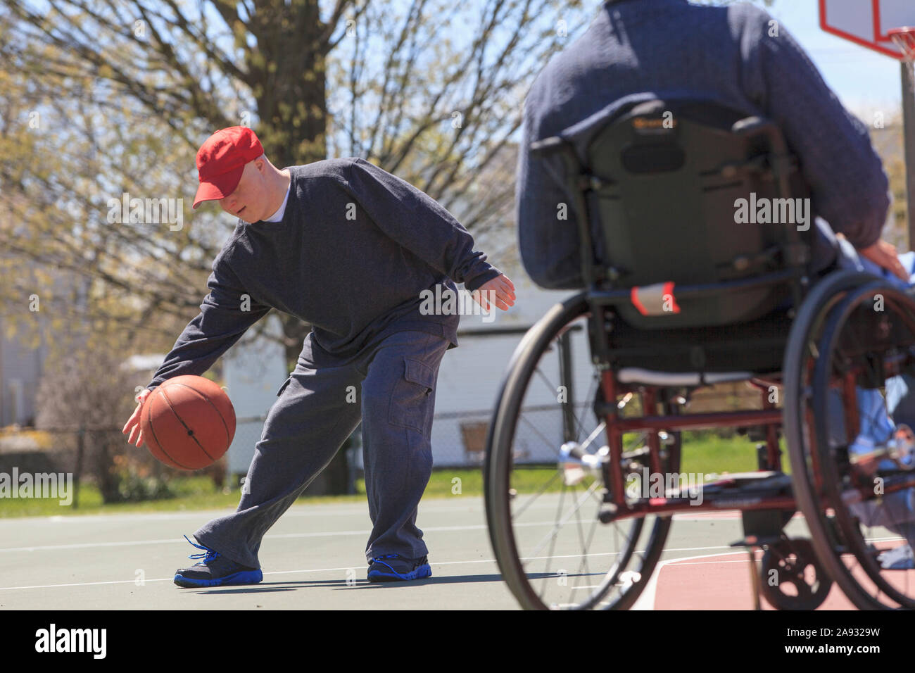 Father with Spinal Cord Injury and his son with Down Syndrome playing ...