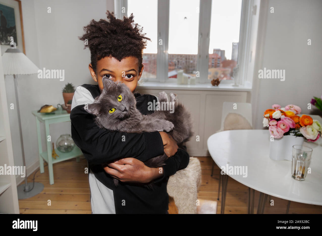 Boy Holding Cat High Resolution Stock Photography and Images - Alamy