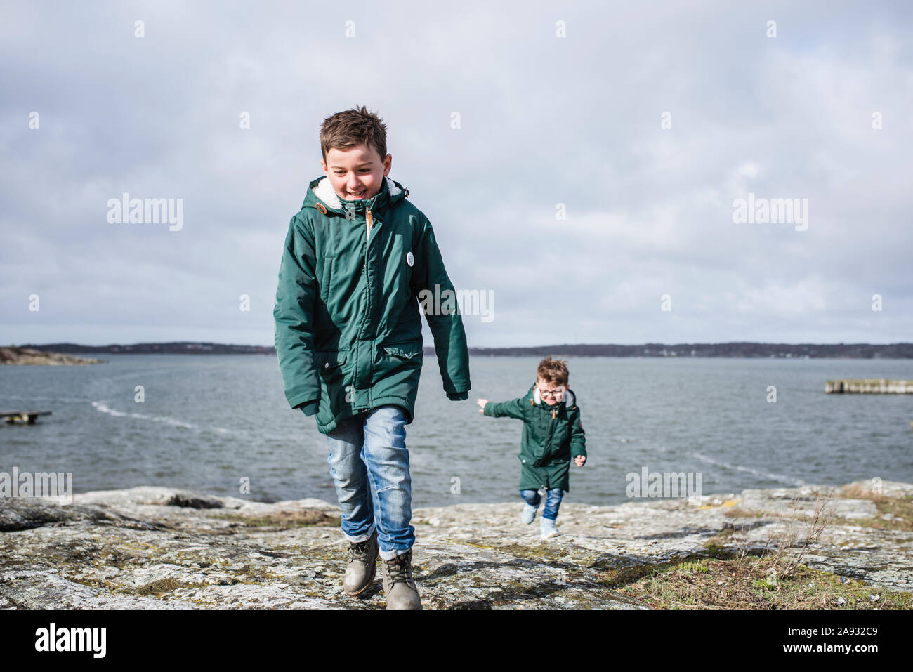 Boy at sea Stock Photo - Alamy