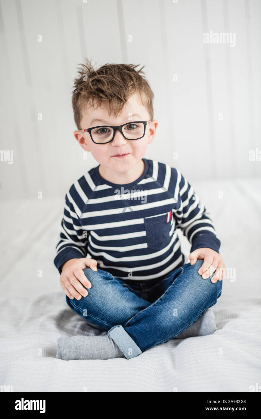 Boy looking at camera Stock Photo - Alamy