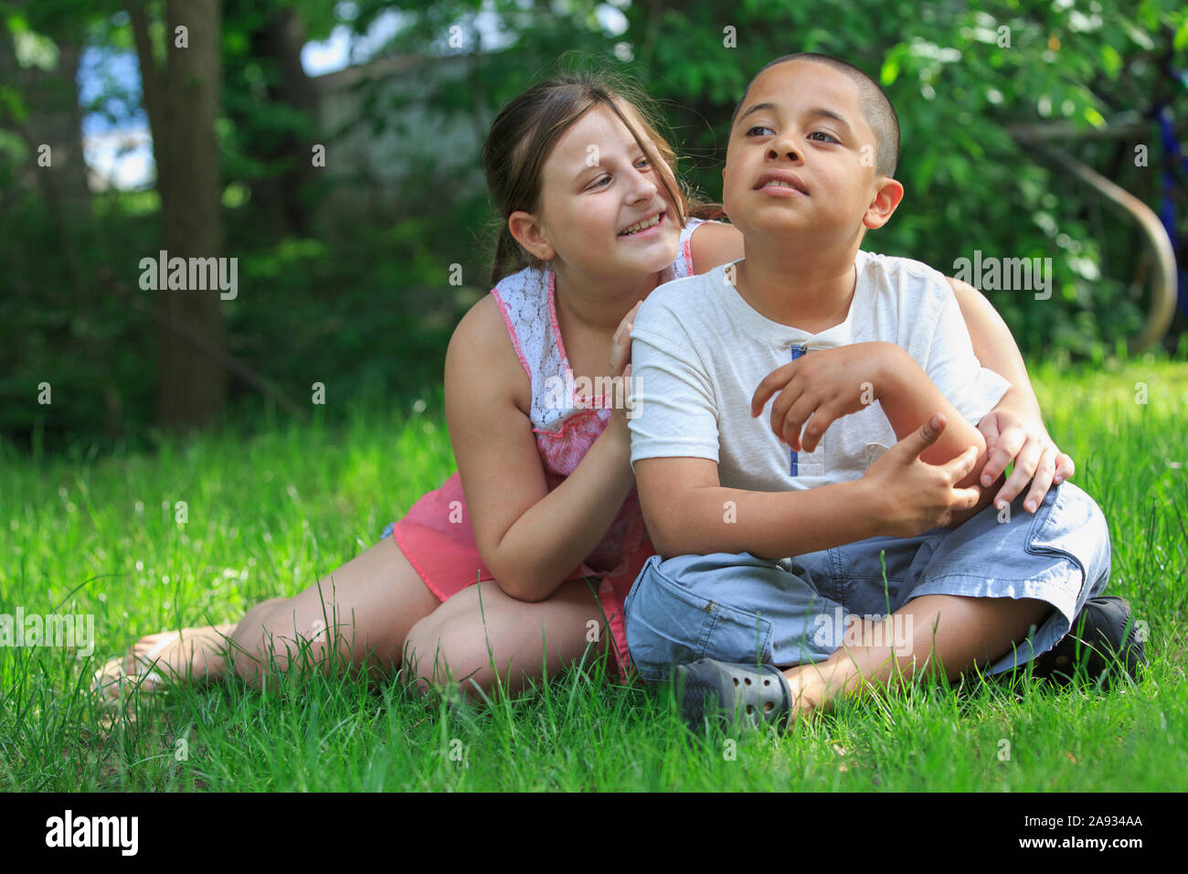 Hispanic boy with Autism playing outside with his sister Stock Photo ...