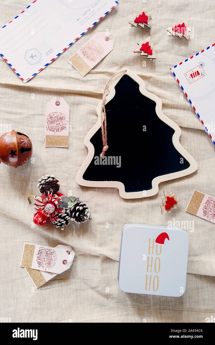 Christmas blackboard with a form of a christmas tree on a juta ...