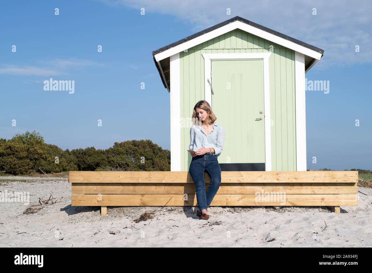 Sitting in beach hut hi-res stock photography and images - Alamy