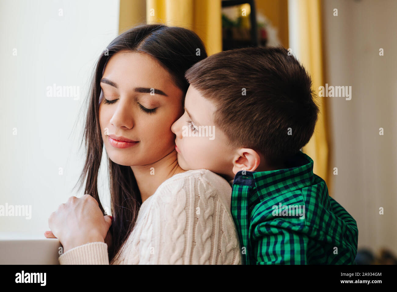 Indian son hugging mother hi-res stock photography and images - Alamy