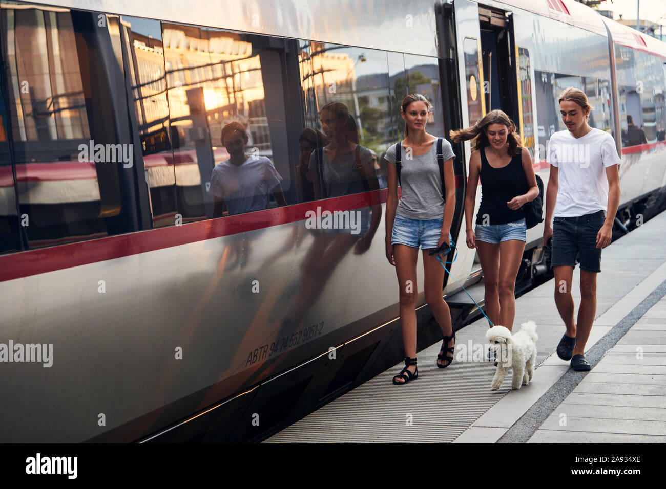 Friends on train station Stock Photo - Alamy
