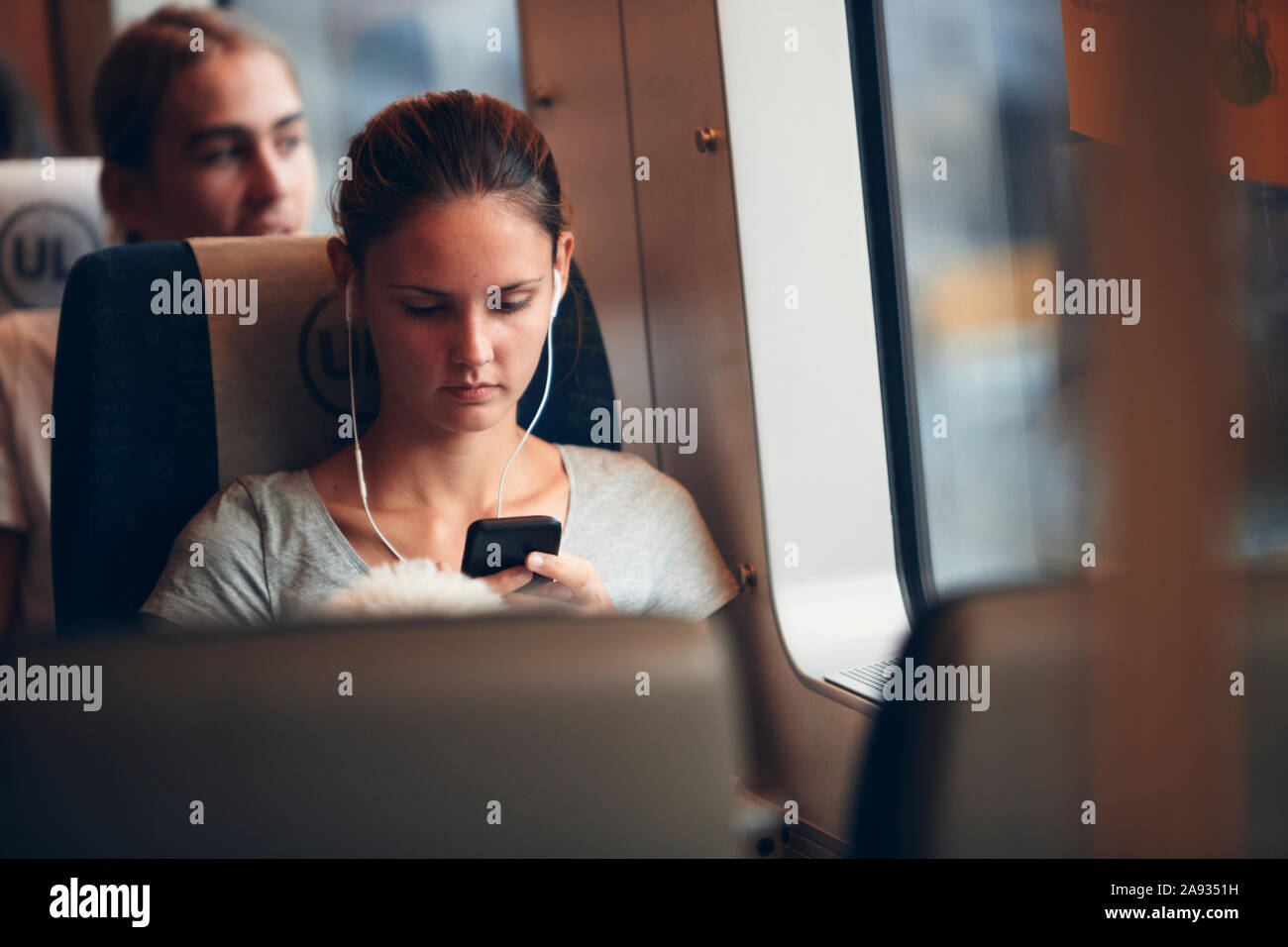 Commuter headphones train hi-res stock photography and images - Alamy