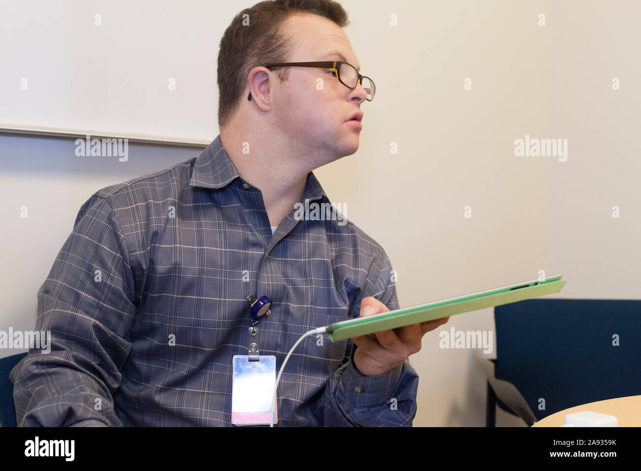Downs syndrome adult office hi-res stock photography and images - Alamy