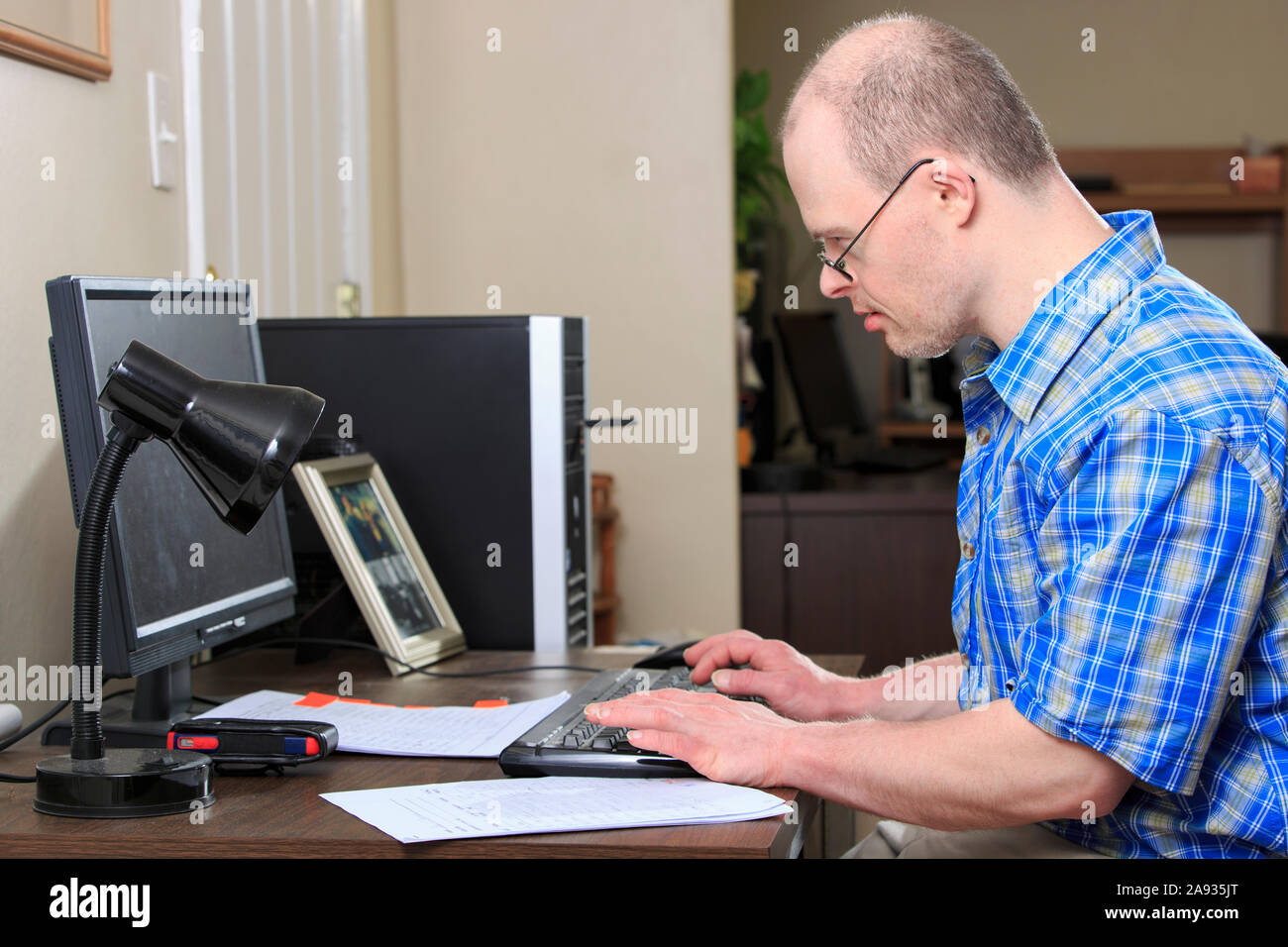 Downs syndrome adult office hi-res stock photography and images - Alamy