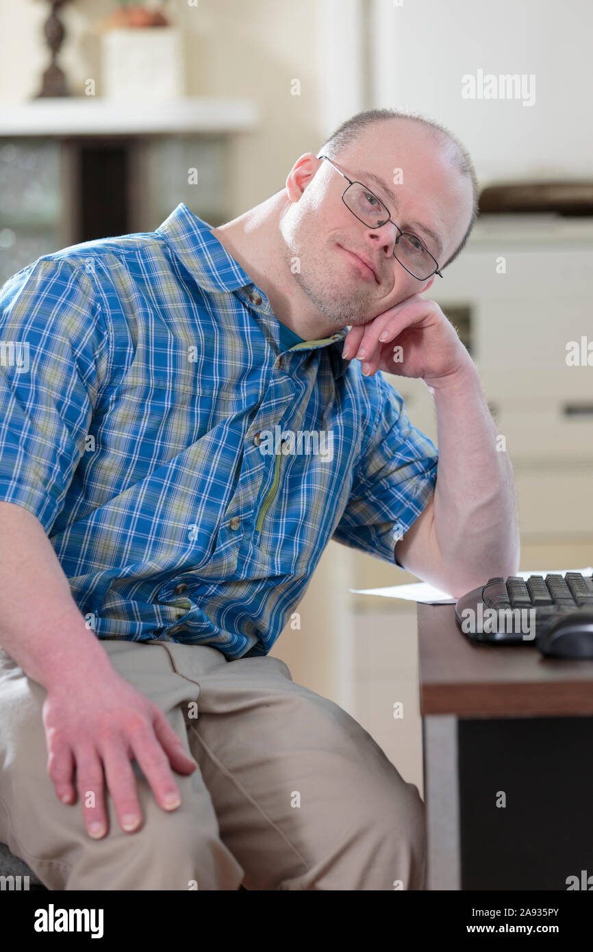 Downs syndrome adult office hi-res stock photography and images - Alamy