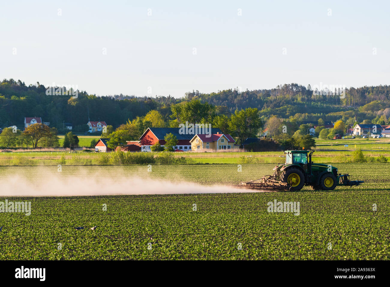 Tractor on field Stock Photo - Alamy
