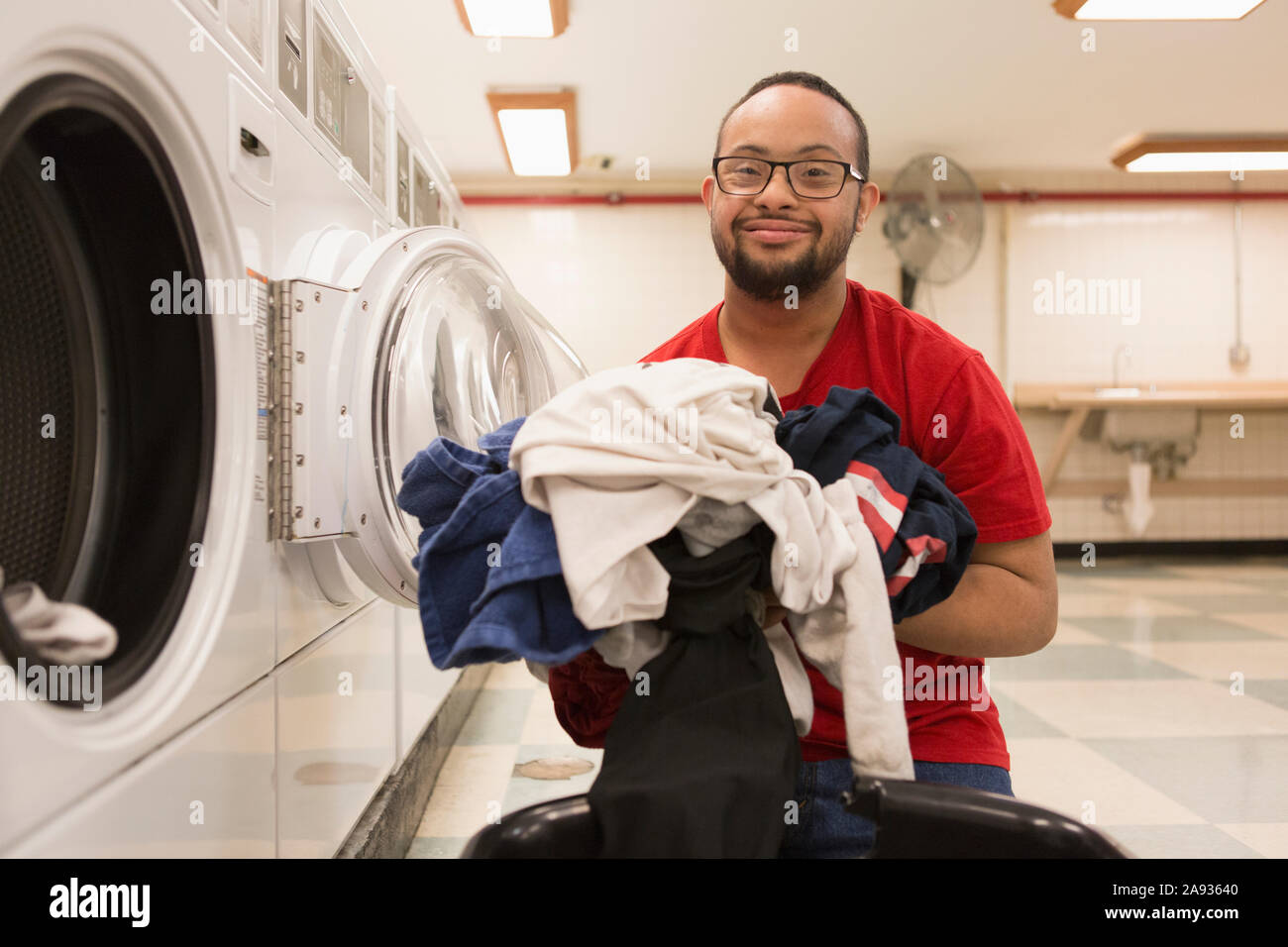 Portrait of young man with laundry hi-res stock photography and images ...