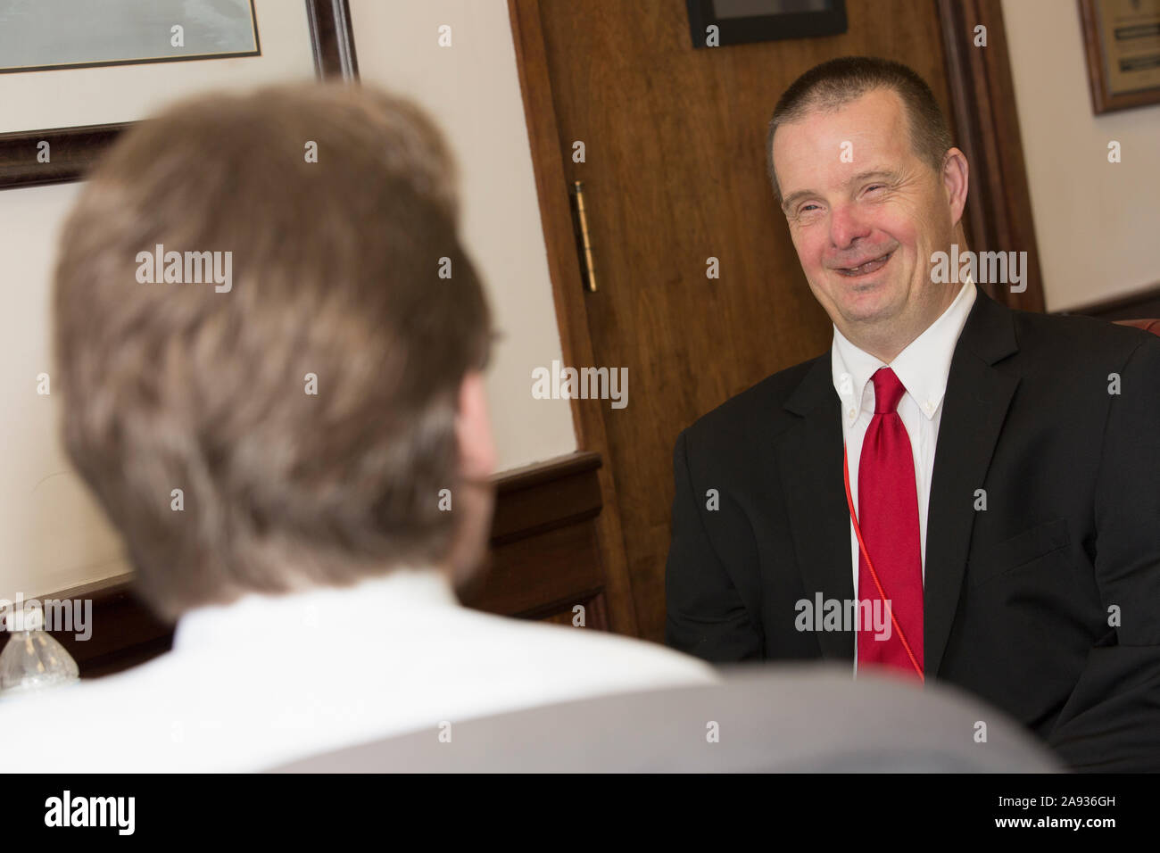Man with Down Syndrome working as a Legislative Assistant with his ...