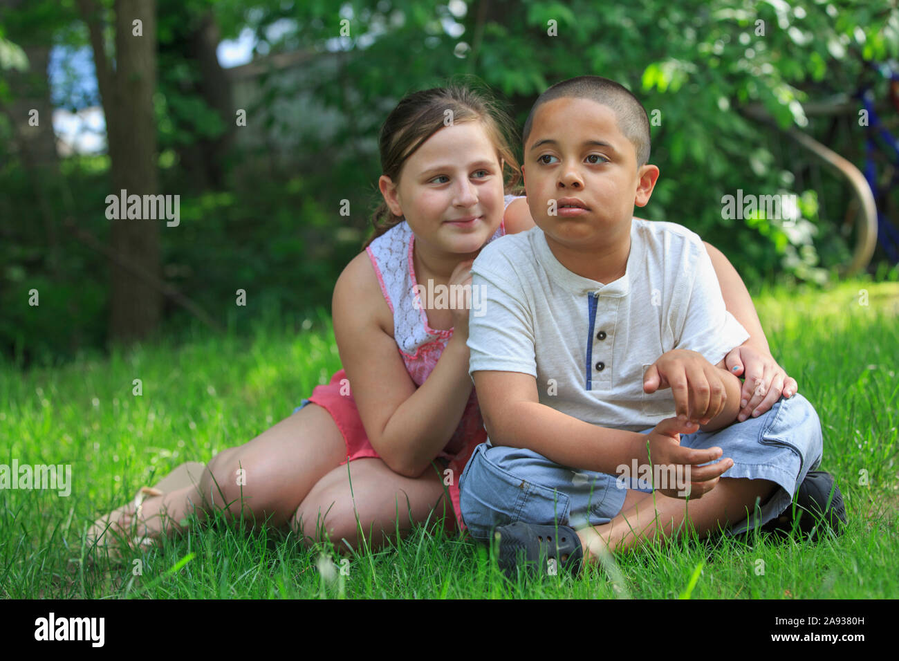 Hispanic boy with Autism playing outside with his sister Stock Photo ...